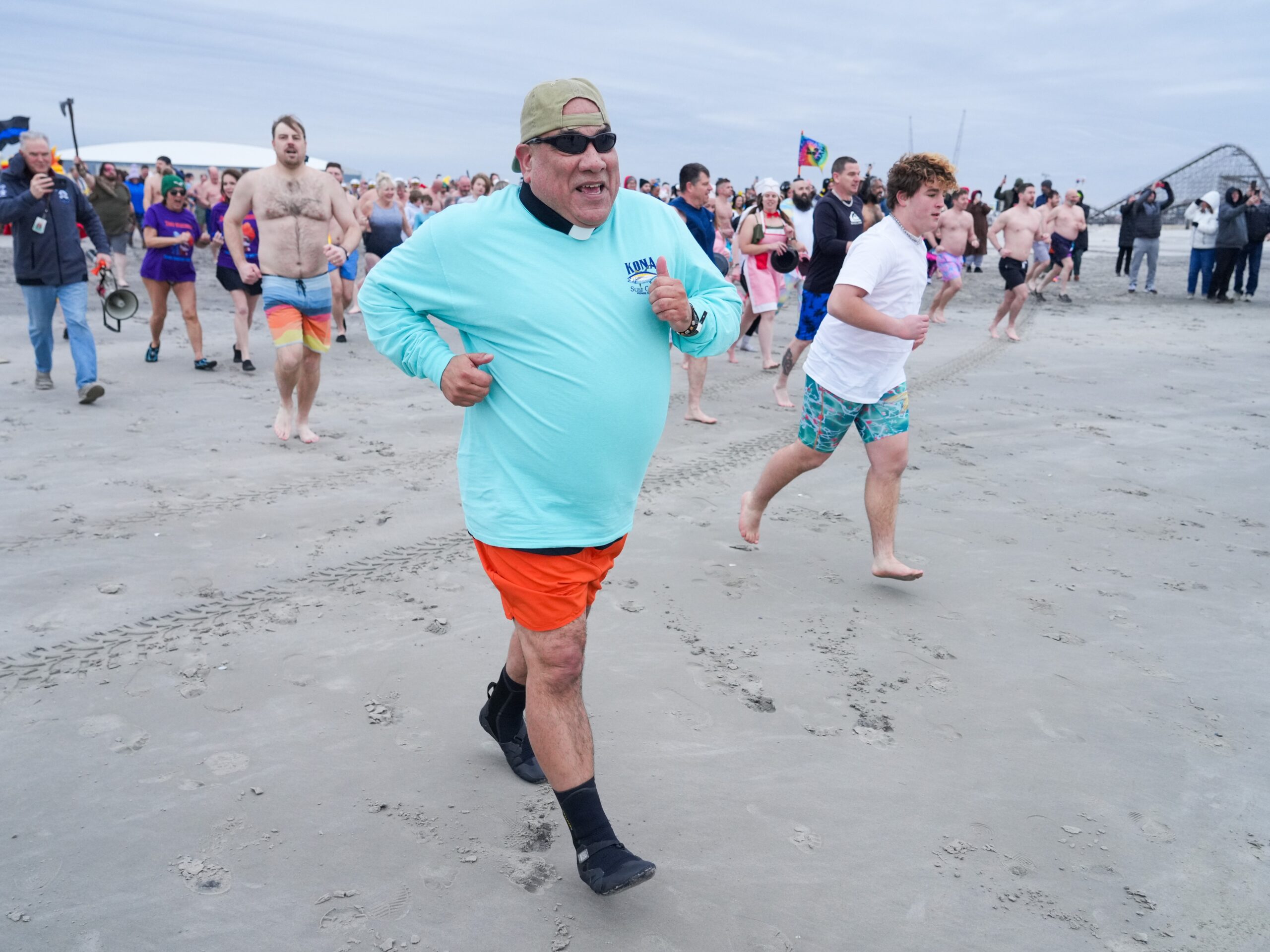 Priest steps outside comfort zone, into cold ocean for charity ...